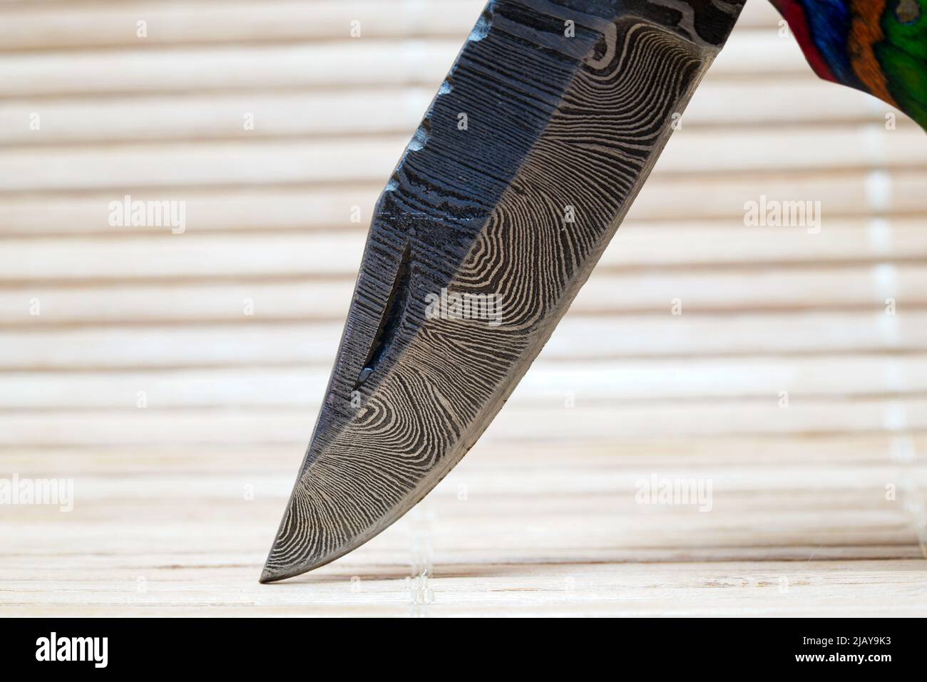 Hand-forged knife made of several layers of steel with an exclusive ...