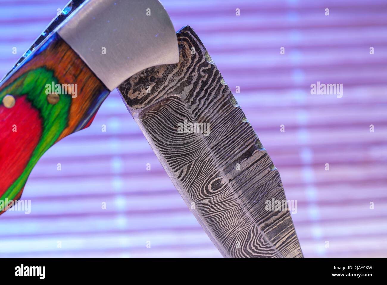 Hand-forged knife made of several layers of steel with an exclusive ...