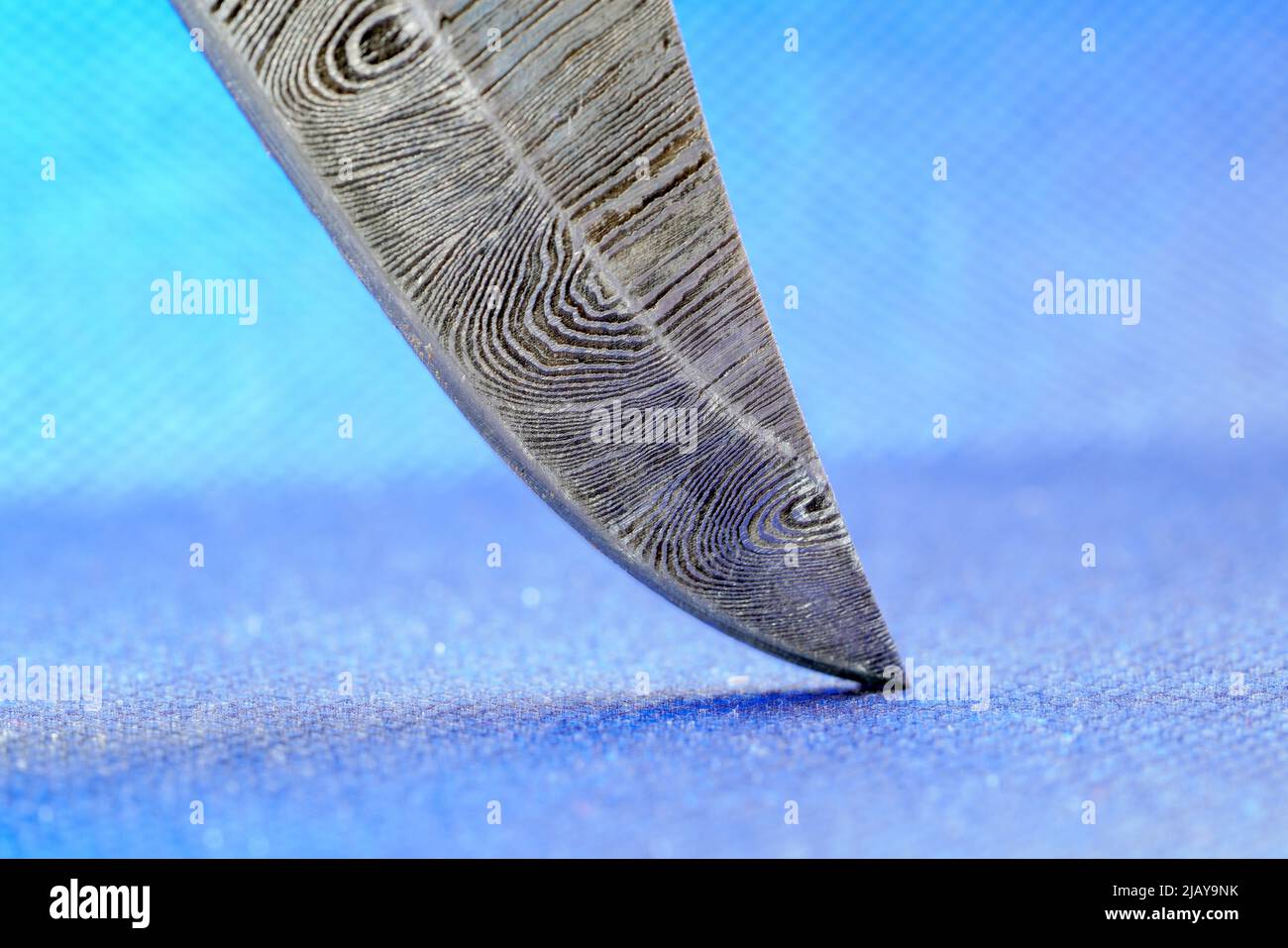 Hand-forged knife made of several layers of steel with an exclusive ...