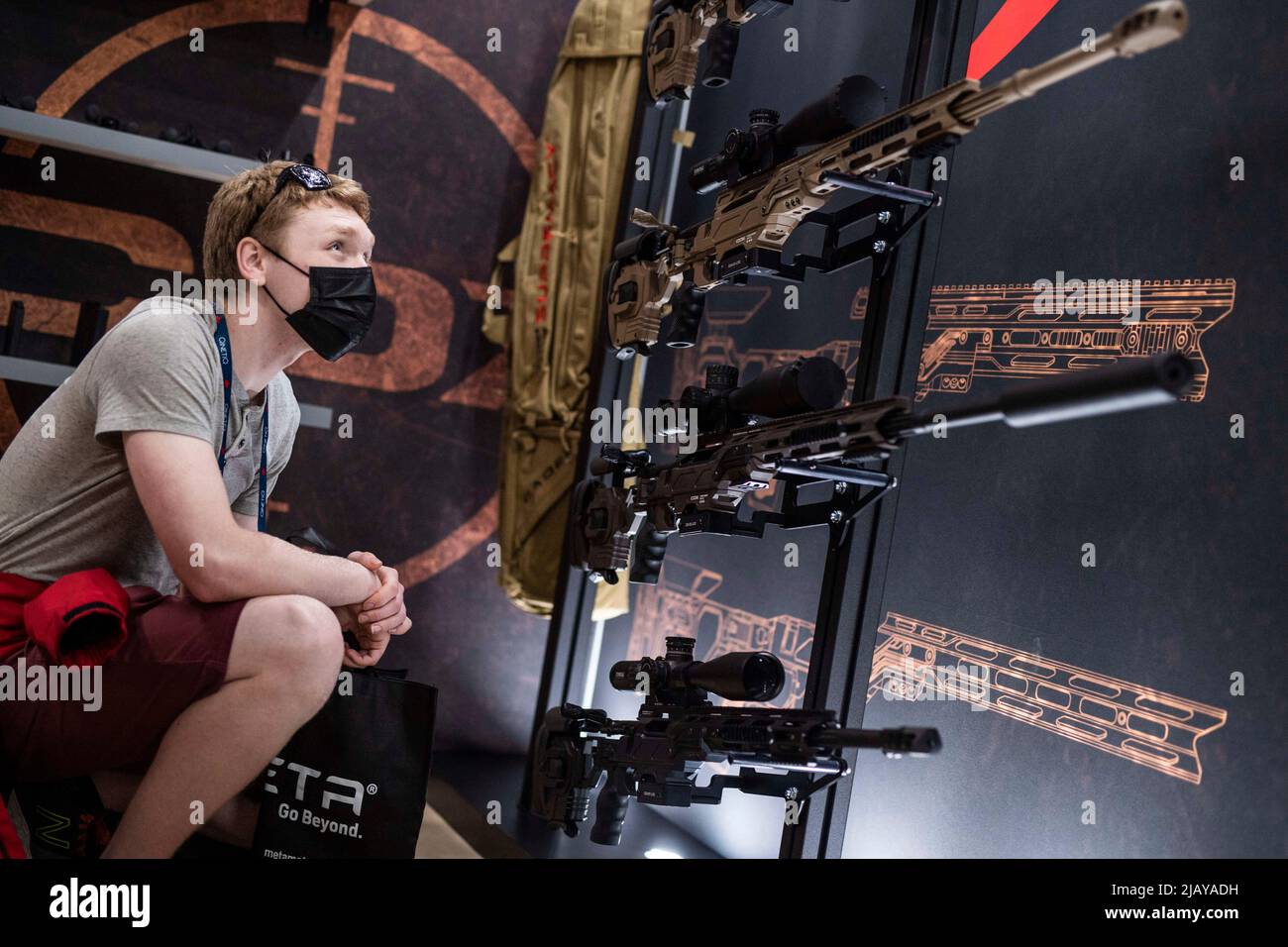Ottawa, Can. 01st June, 2022. An attendee takes a look at rifles from ...