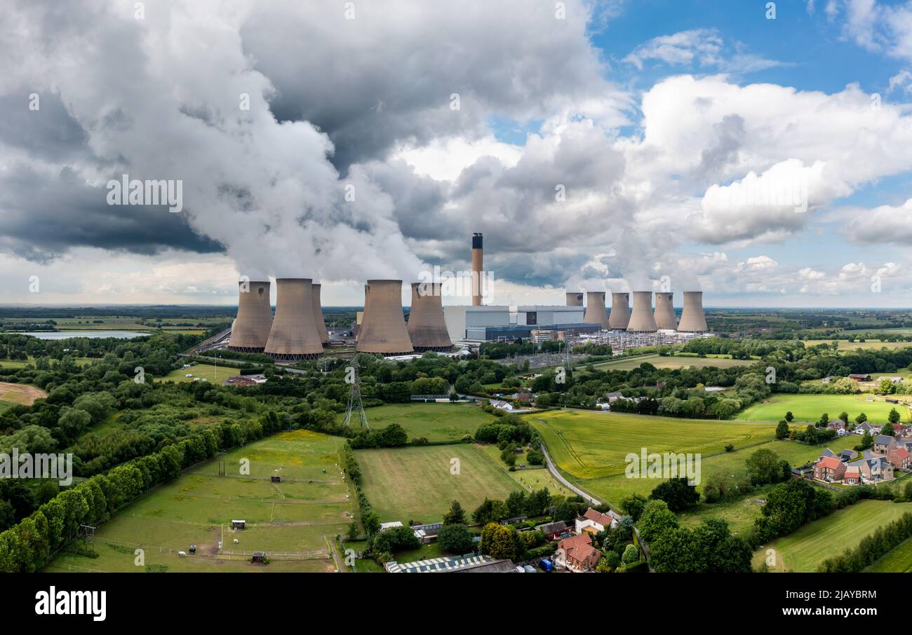 Aerial landscape view of Drax Power Station in North Yorkshire with smoking chimneys and cooling ...