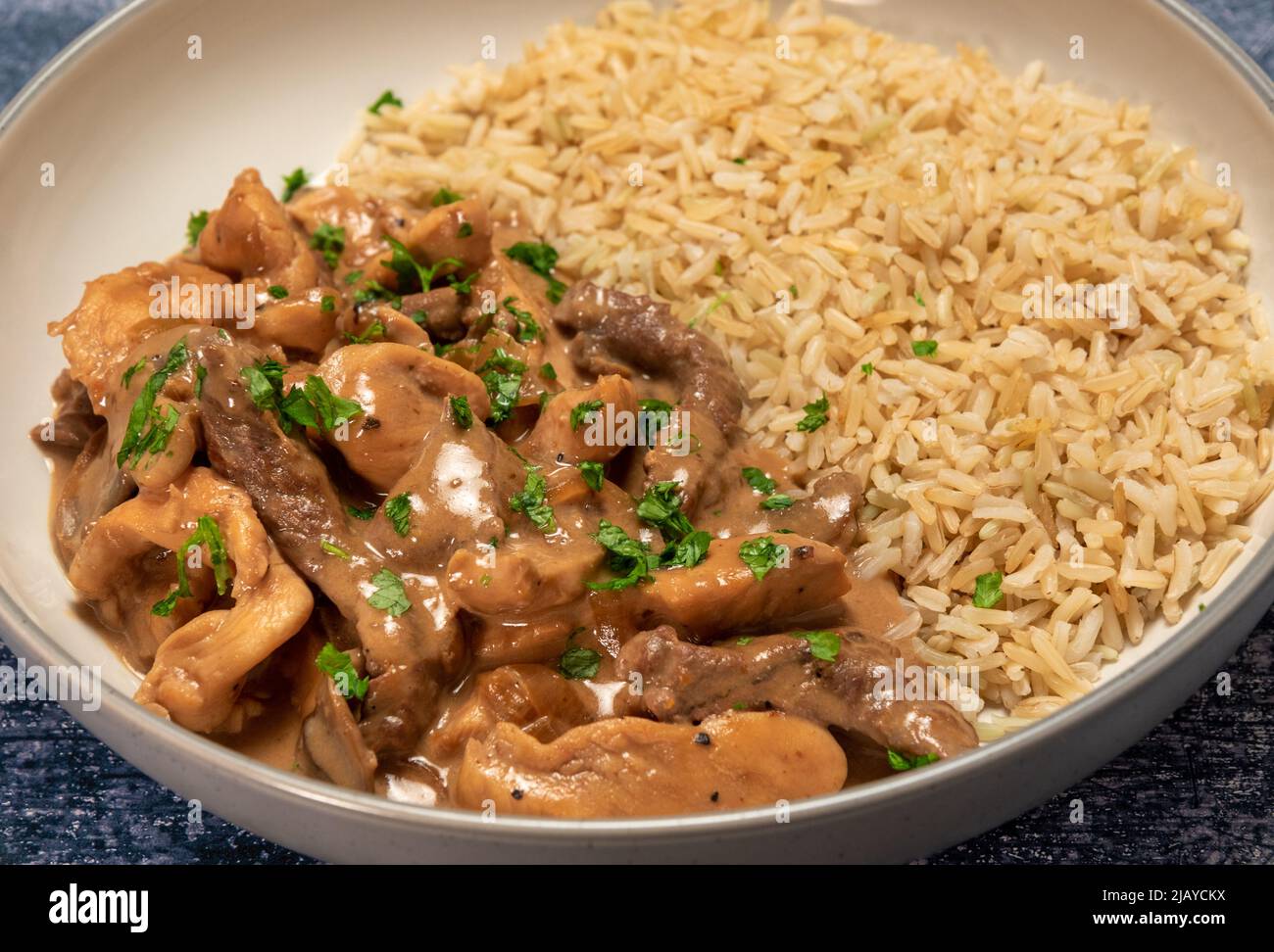 'cock & bull' (chicken and steak with rice Stock Photo - Alamy