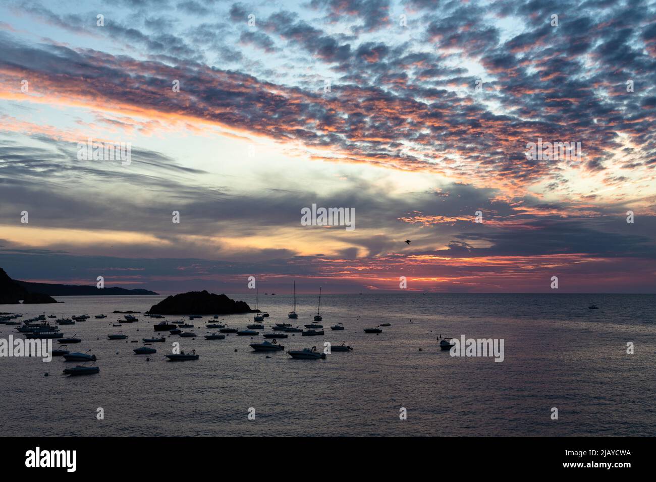 Sunrise on the bay of Tossa de mar, Spain, rising of the sun on the ...