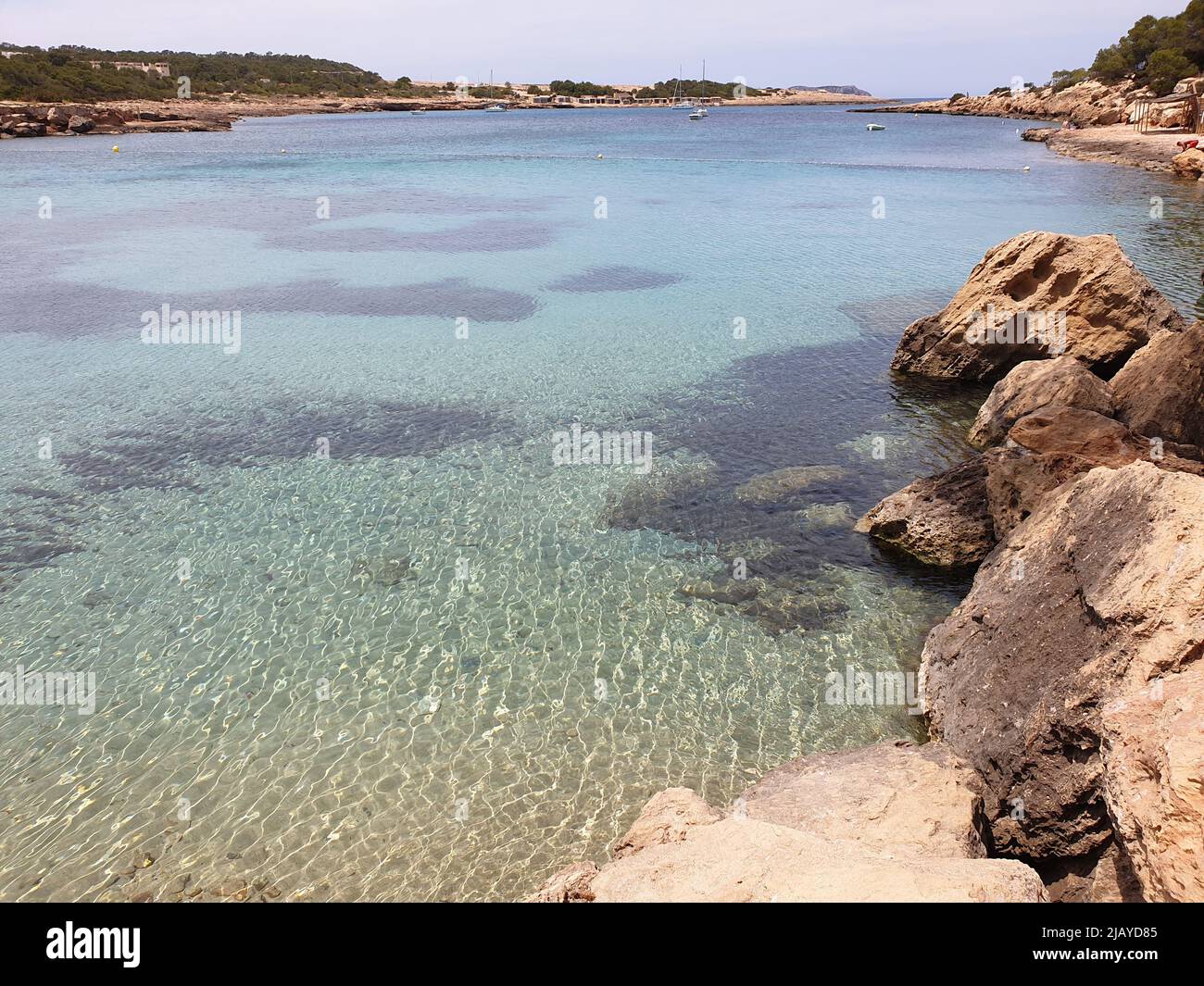 Alma beach in Ibiza, rocky beach with cristal turquoise water, Spain ...
