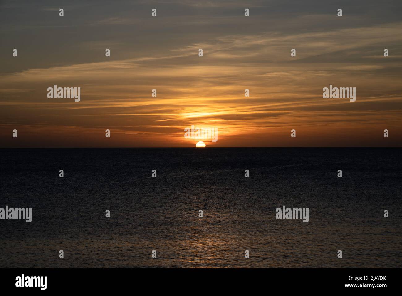 Sunset in Ibiza, sun goes down into the sea, Spain Stock Photo - Alamy