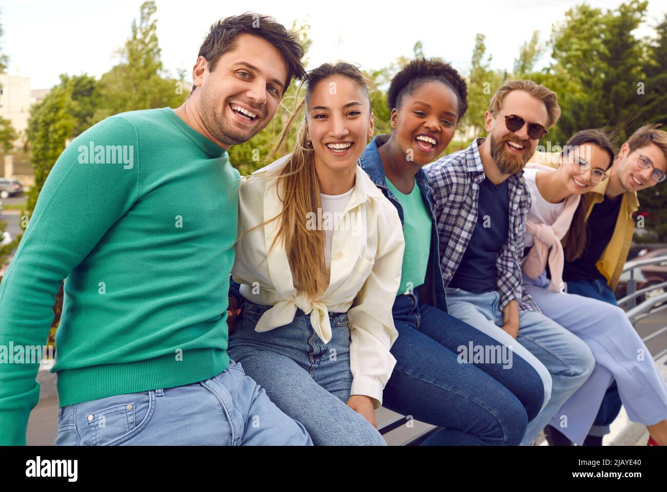 Group of happy young international friends having fun during their meet ...