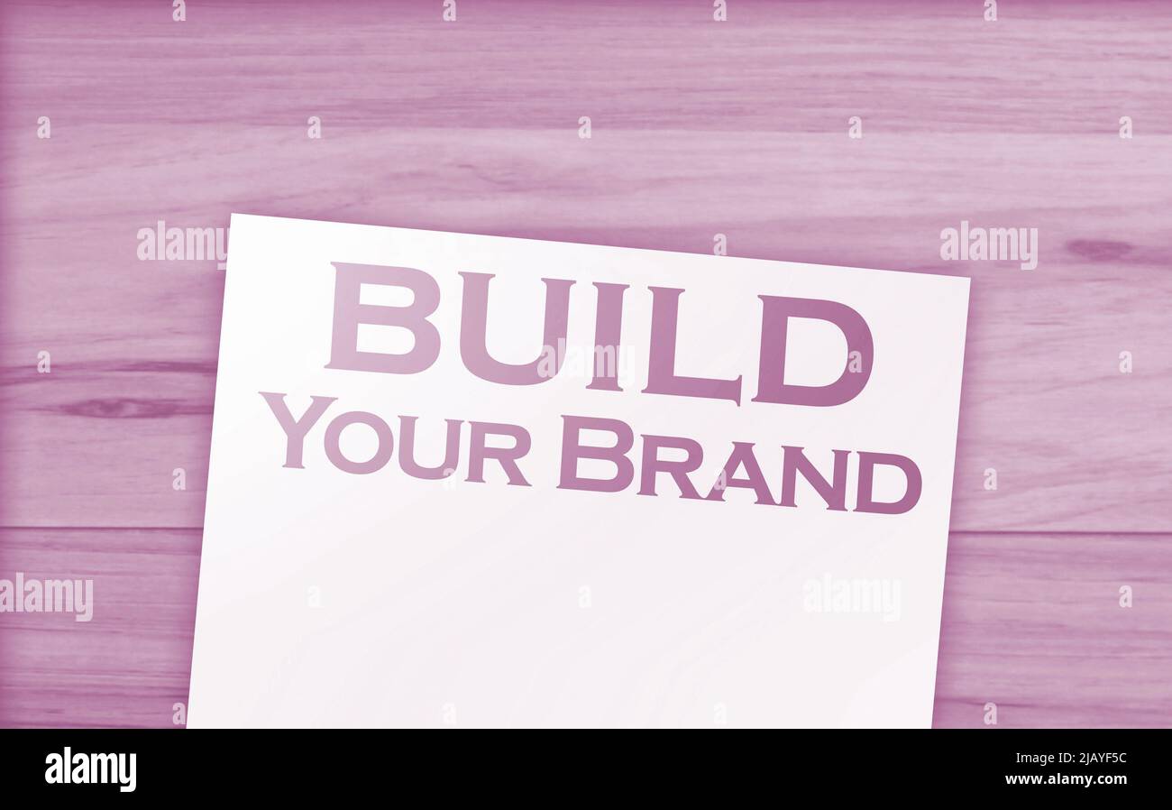Build Your Own Brand words on a page and paper dollar signs around on ...