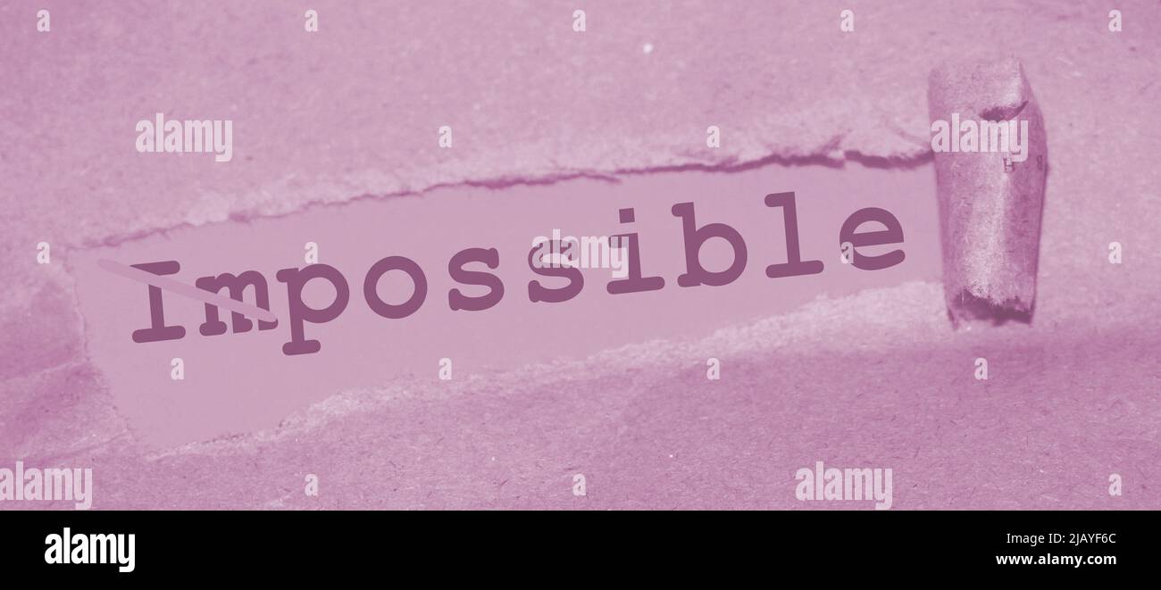torn paper with IMPOSSIBLE word turned to Possible by crossing IM ...