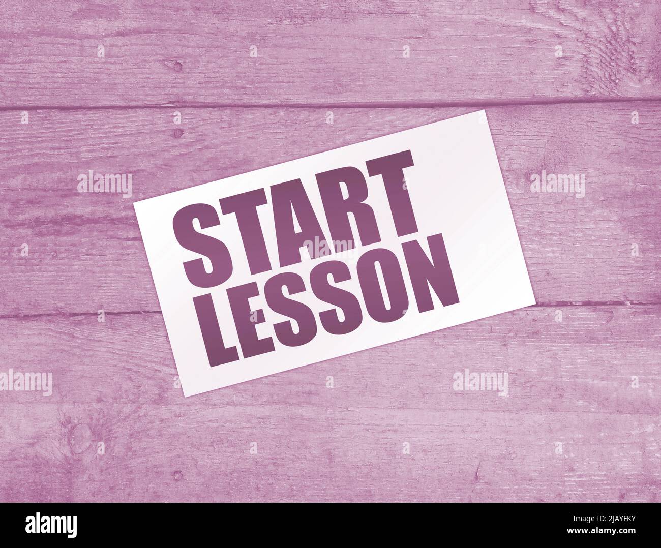 Start lesson words on card on wooden table. Education concept Stock ...