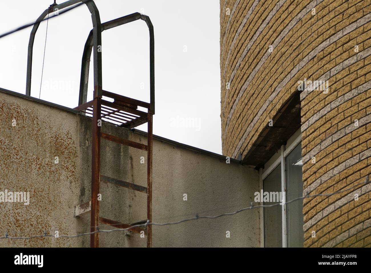 Vertical fire escape on the building. Fire safety Stock Photo - Alamy