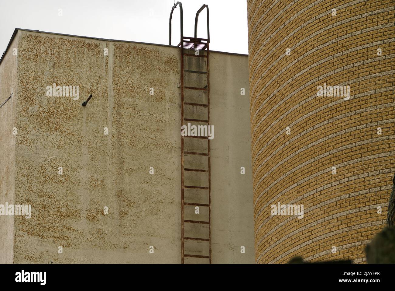 Vertical fire escape on the building. Fire safety Stock Photo - Alamy