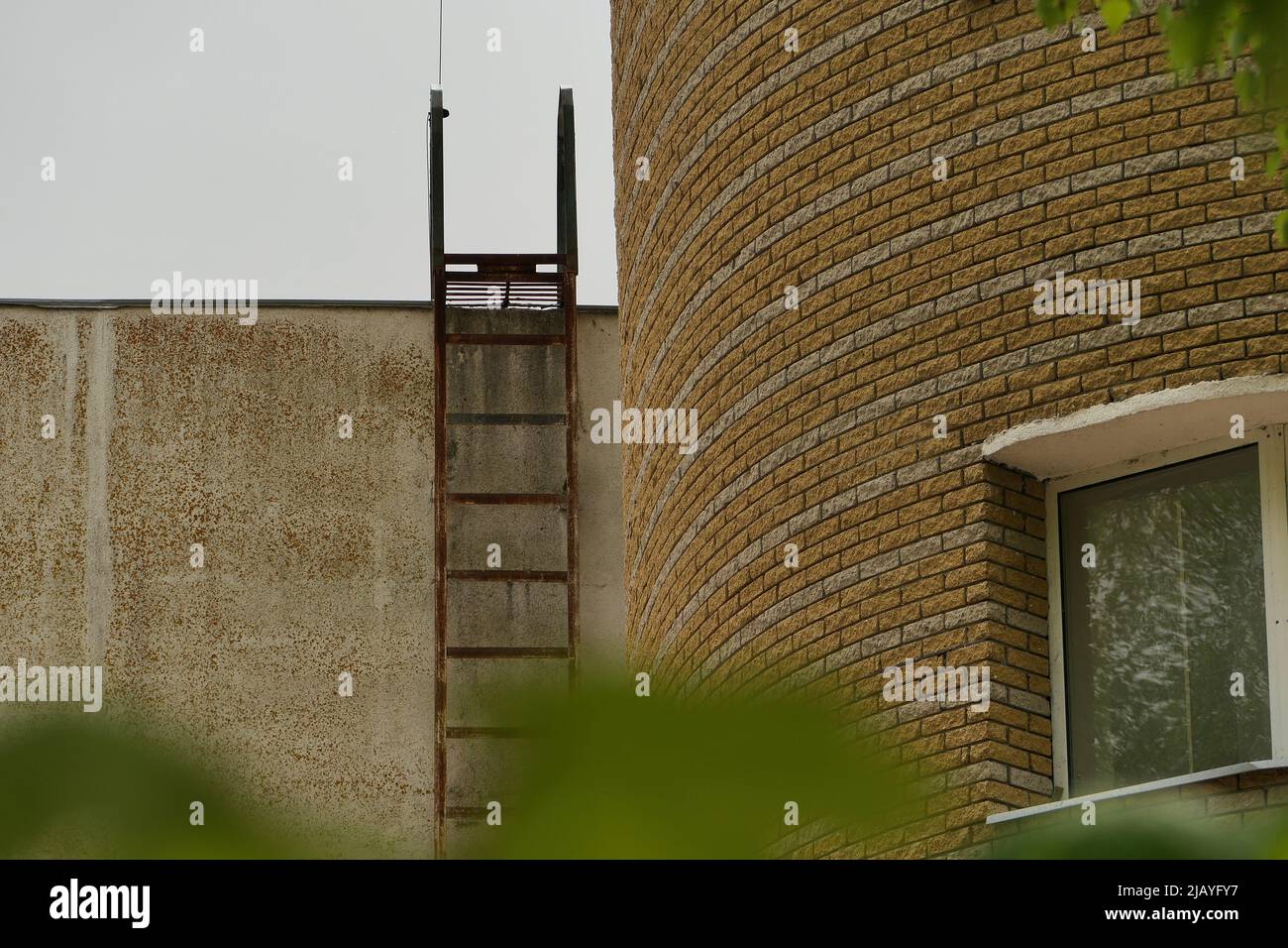 Vertical fire escape on the building. Fire safety Stock Photo - Alamy