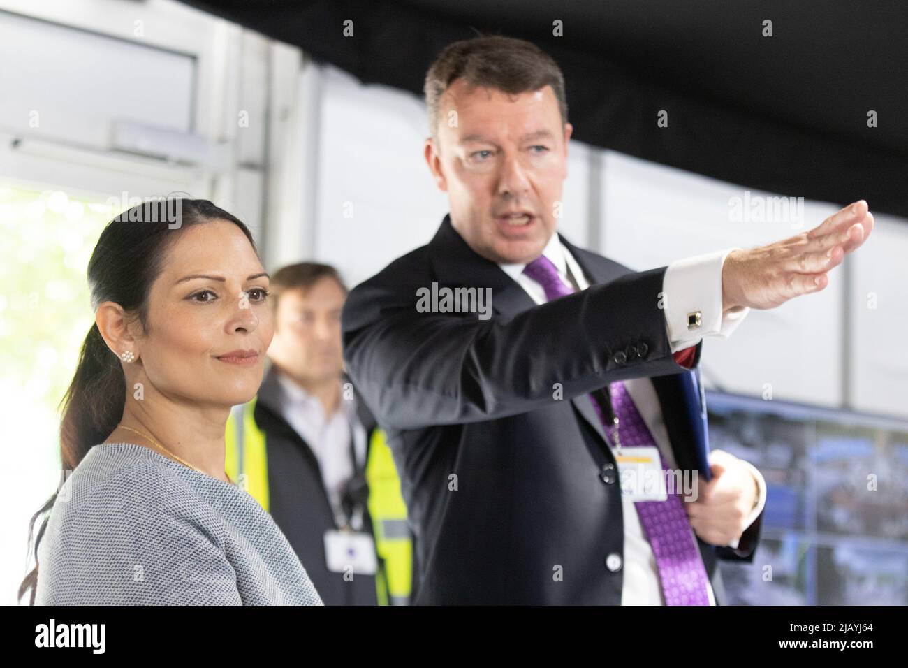 Home Secretary Priti Patel, during a tour led by Andrew Dent (right ...