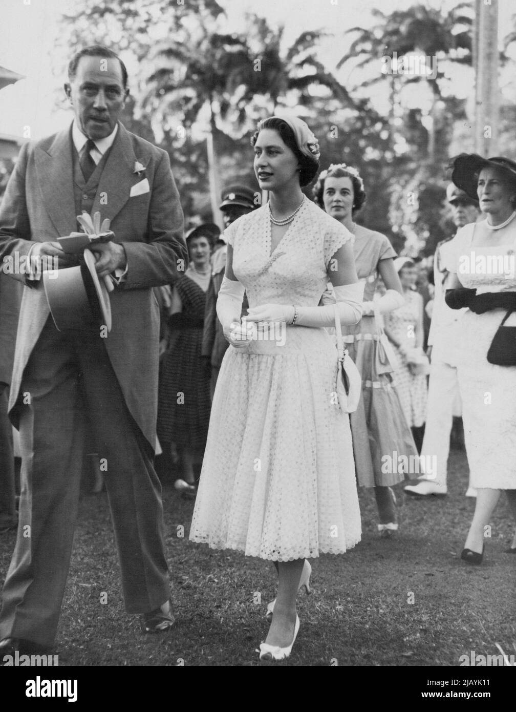 Princess Margaret, wearing a cool white cotton lace dress with a small ...