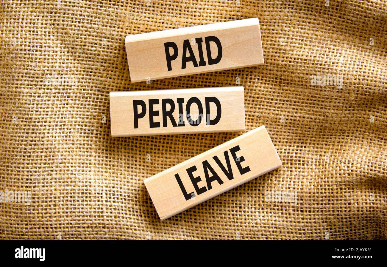 Paid period leave symbol. Concept words Paid period leave on wooden ...