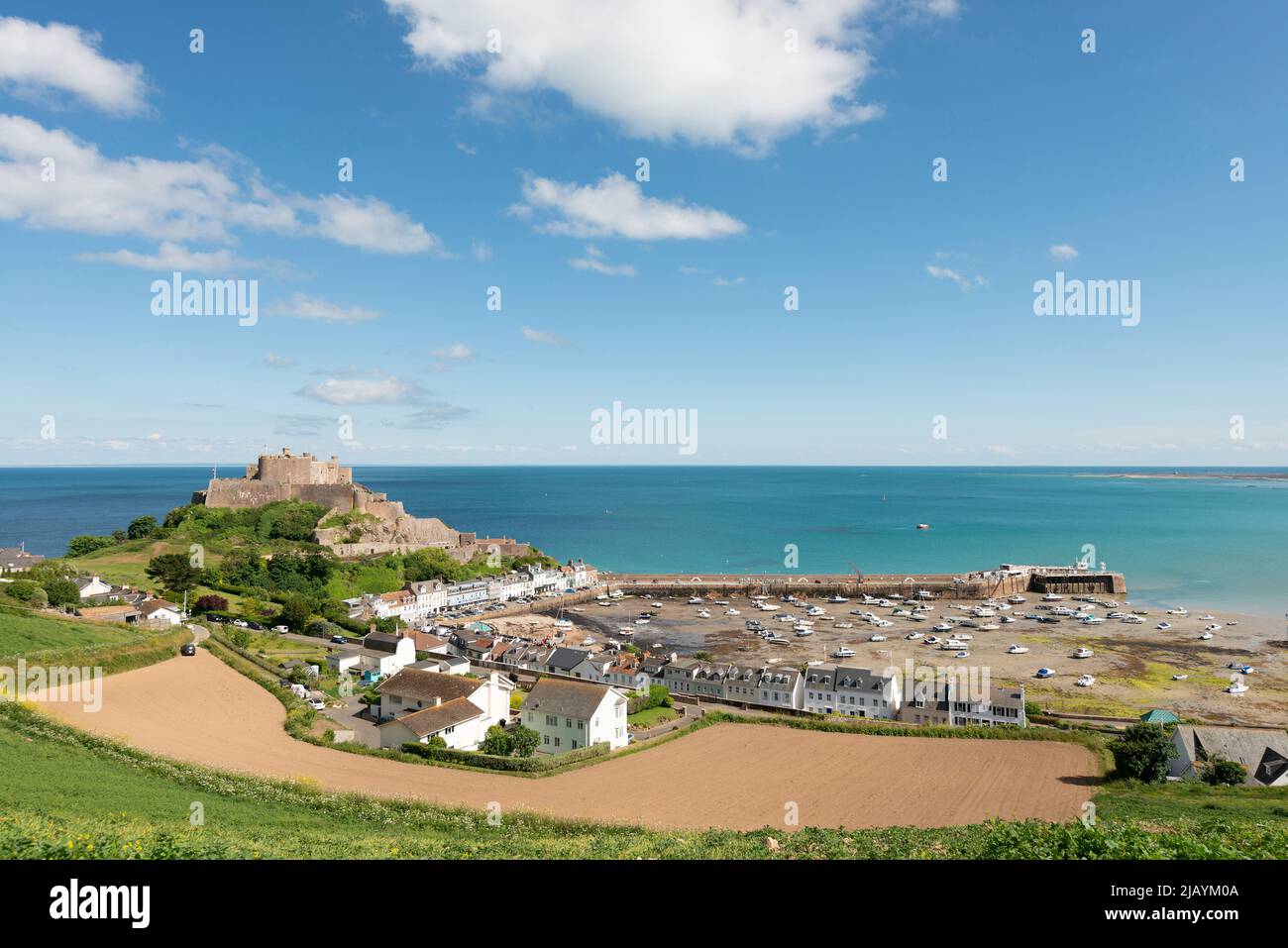 Mont Orgueil Castle (Gorey Castle), village and harbour Stock Photo - Alamy