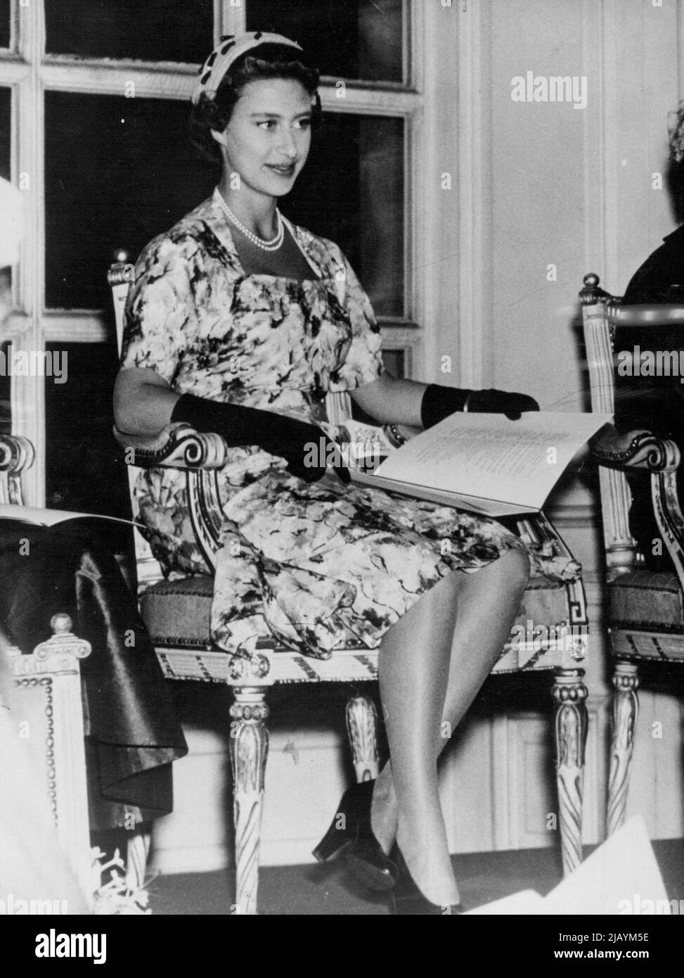 Studying the catalogue. Princess Margaret at the fashion show which was ...