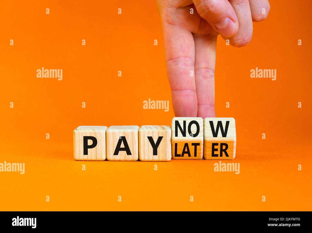 Pay later or now symbol. Businessman turns wooden cubes and changes ...