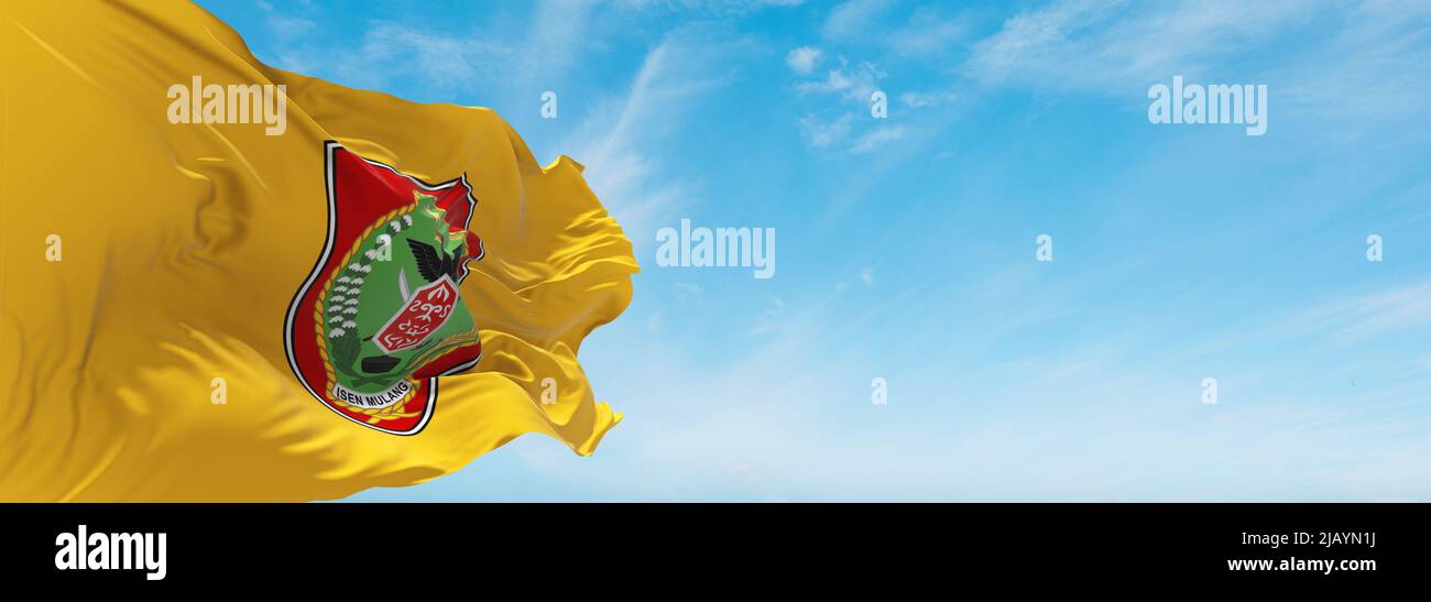 official flag of Central Kalimantan Indonesia at cloudy sky background ...