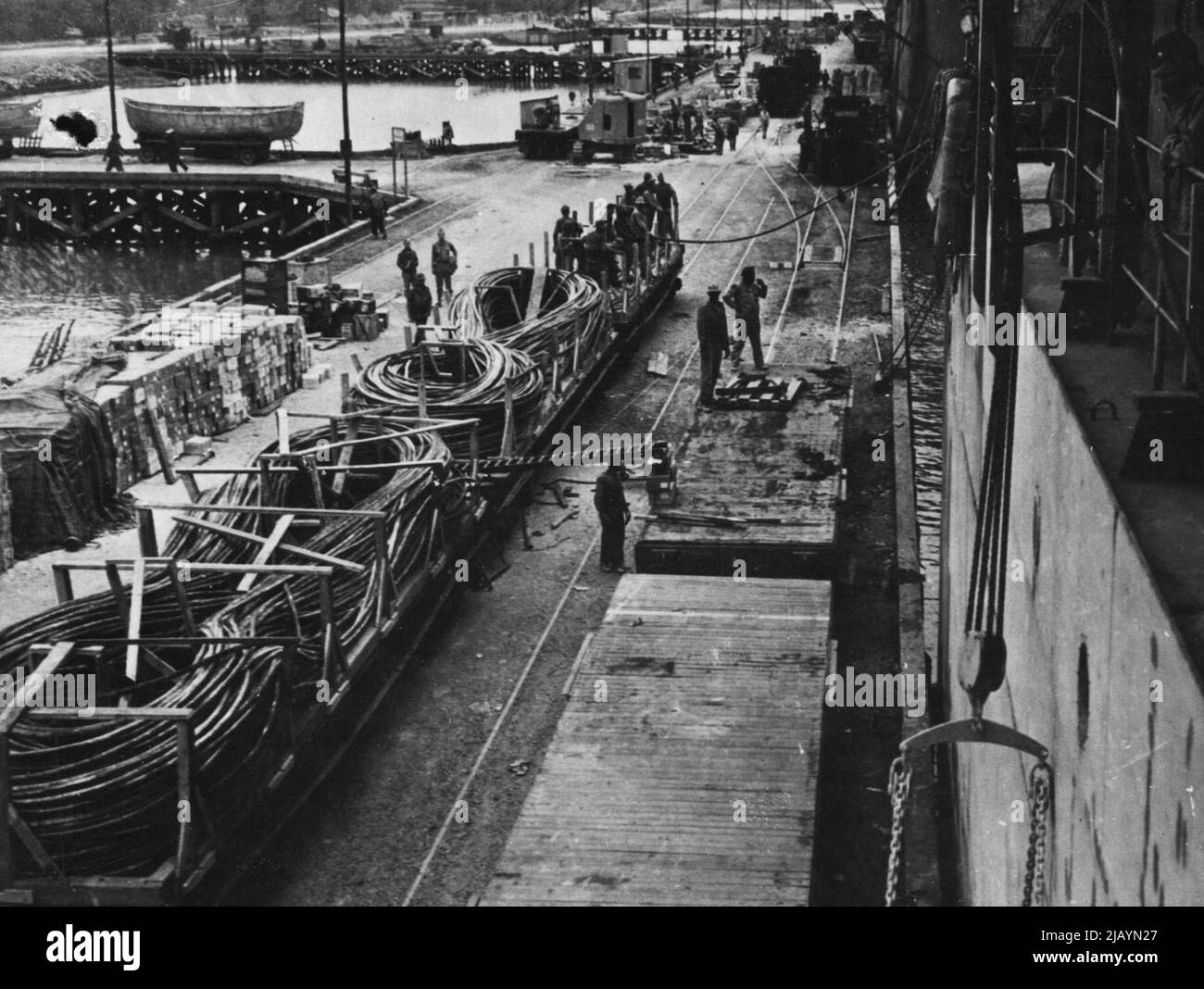 American soldiers transfer steel cable - part of a shipment of 76 miles ...