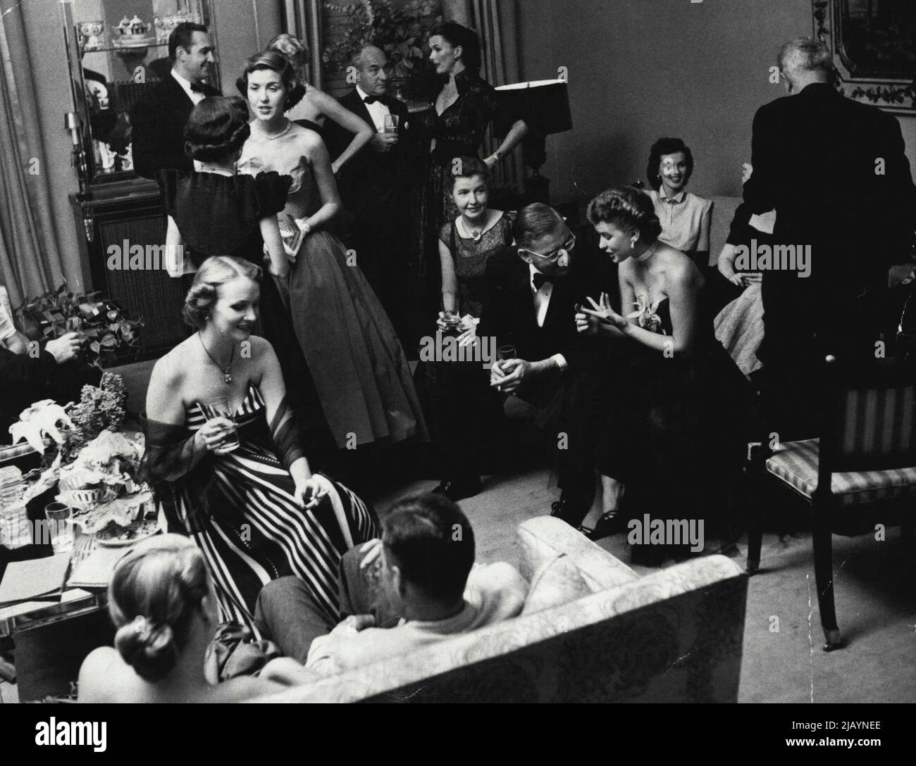 Lewyt concentrates on charming guest at one of his recent parties. Man ...