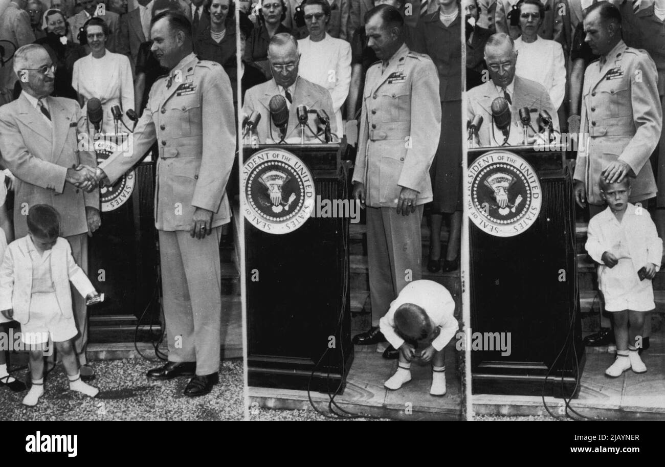 Restless John Steals The Show -- While President Truman was awarding ...