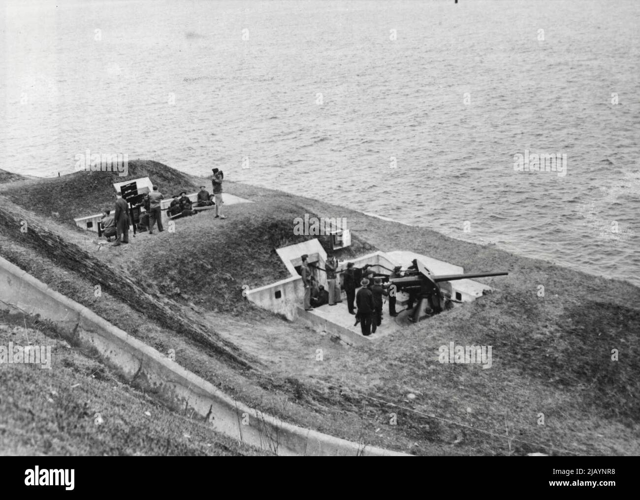 Members of Battery "F" of the 9th Coast artillery practice with a 3 ...