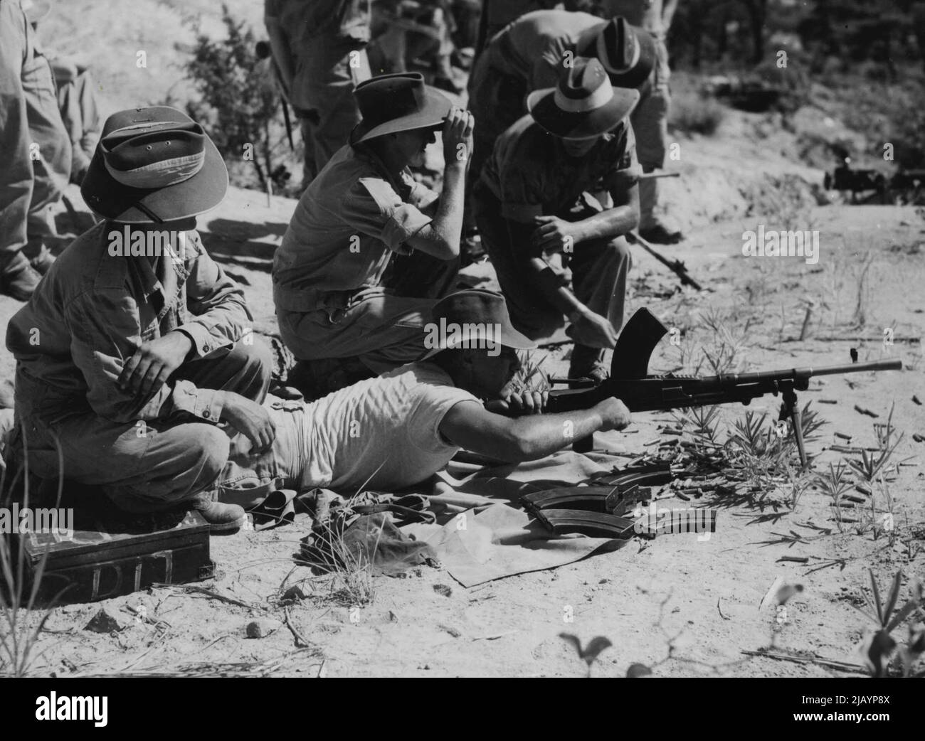 Men of 3 Bn Royal Australian Regiment observe Bren Gun fire during ...