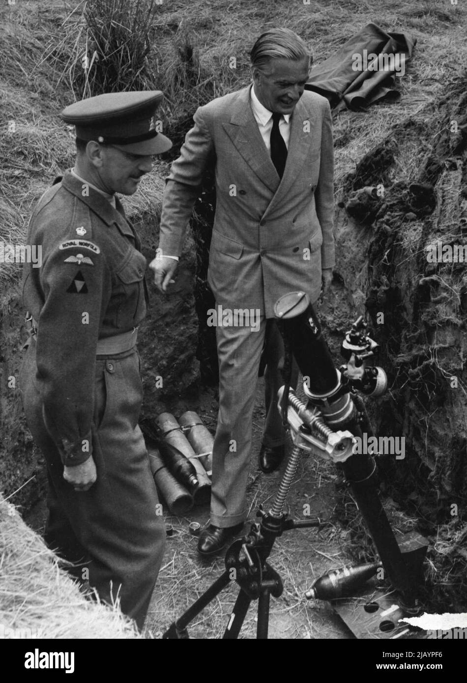 P.M. Visits Eastern Command: Sir Anthony Eden inspects a mortar pit ...