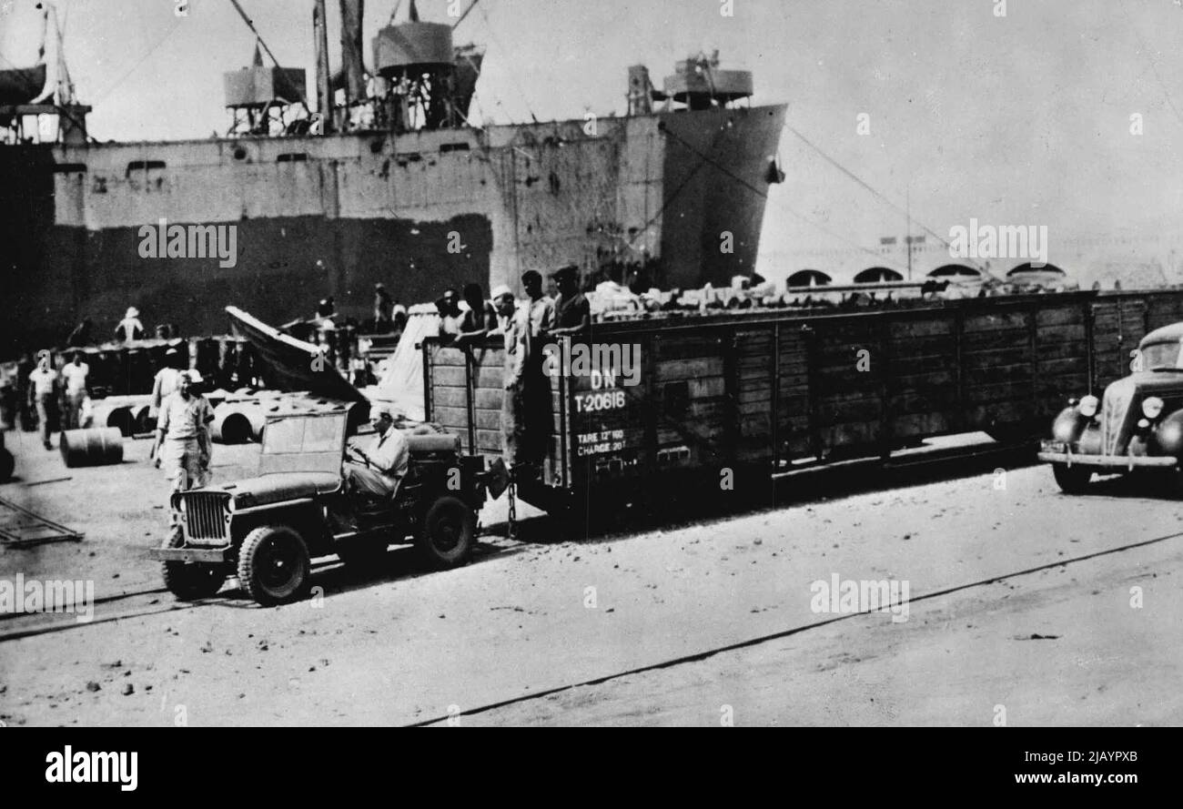 U.S. Jeep Hauls Freight Car In Africa -- At the port of Dakar in French ...