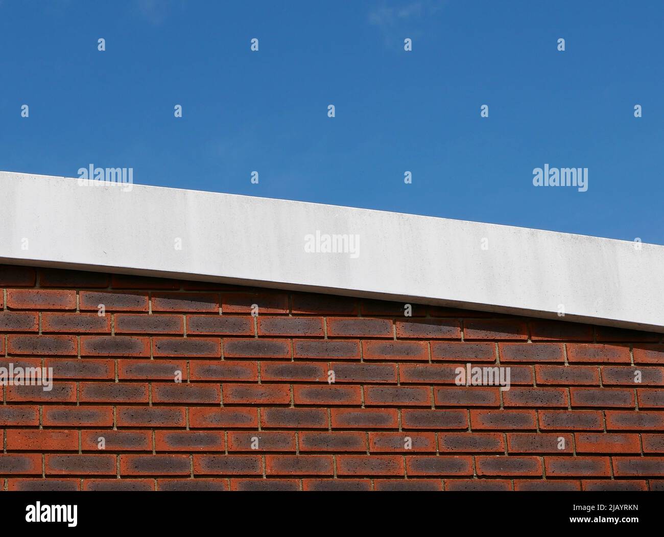 Deep blue sky above brick wall with white border with copy space Stock ...