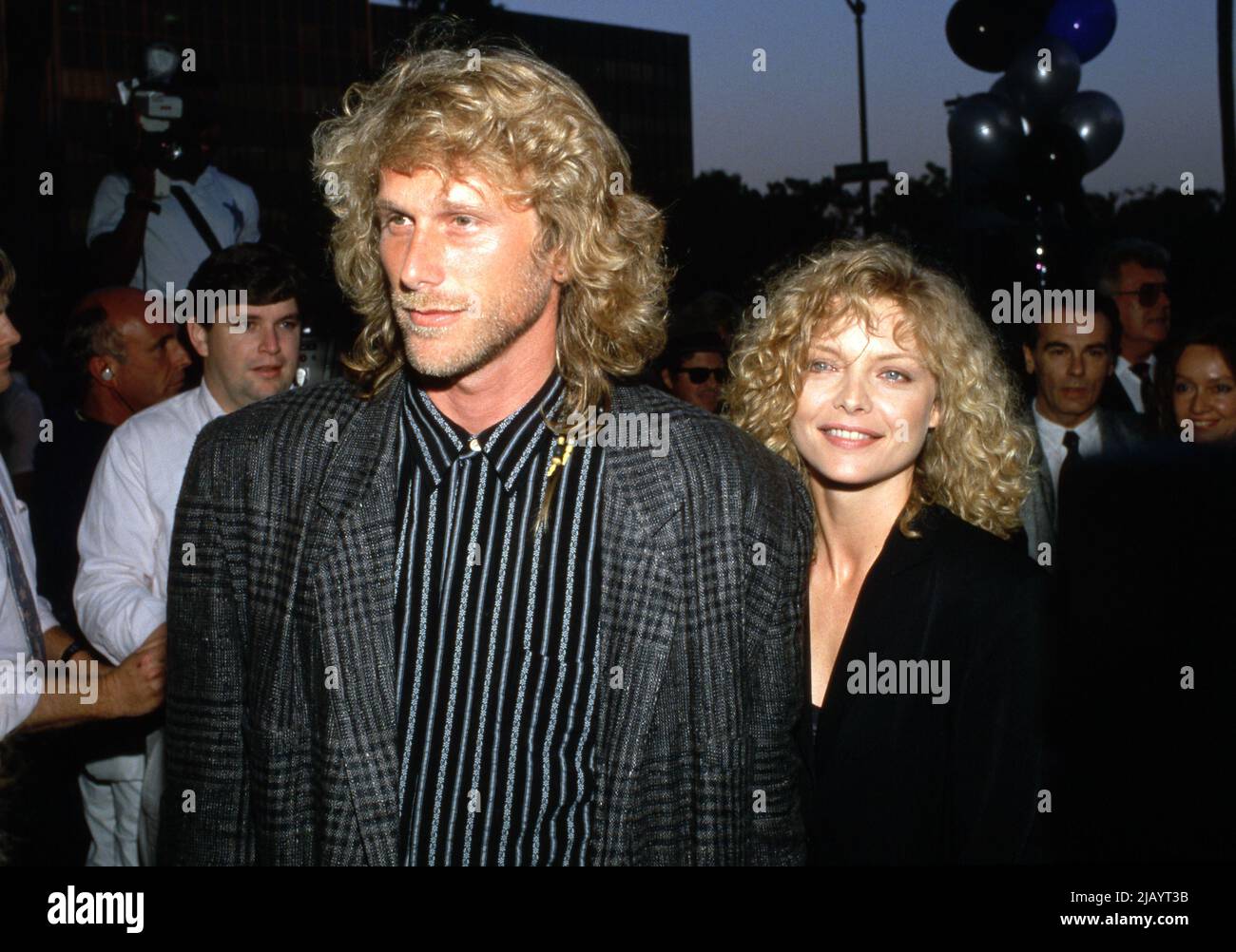 Michelle Pfeiffer with Peter Horton at the Married to the Mob Premiere ...
