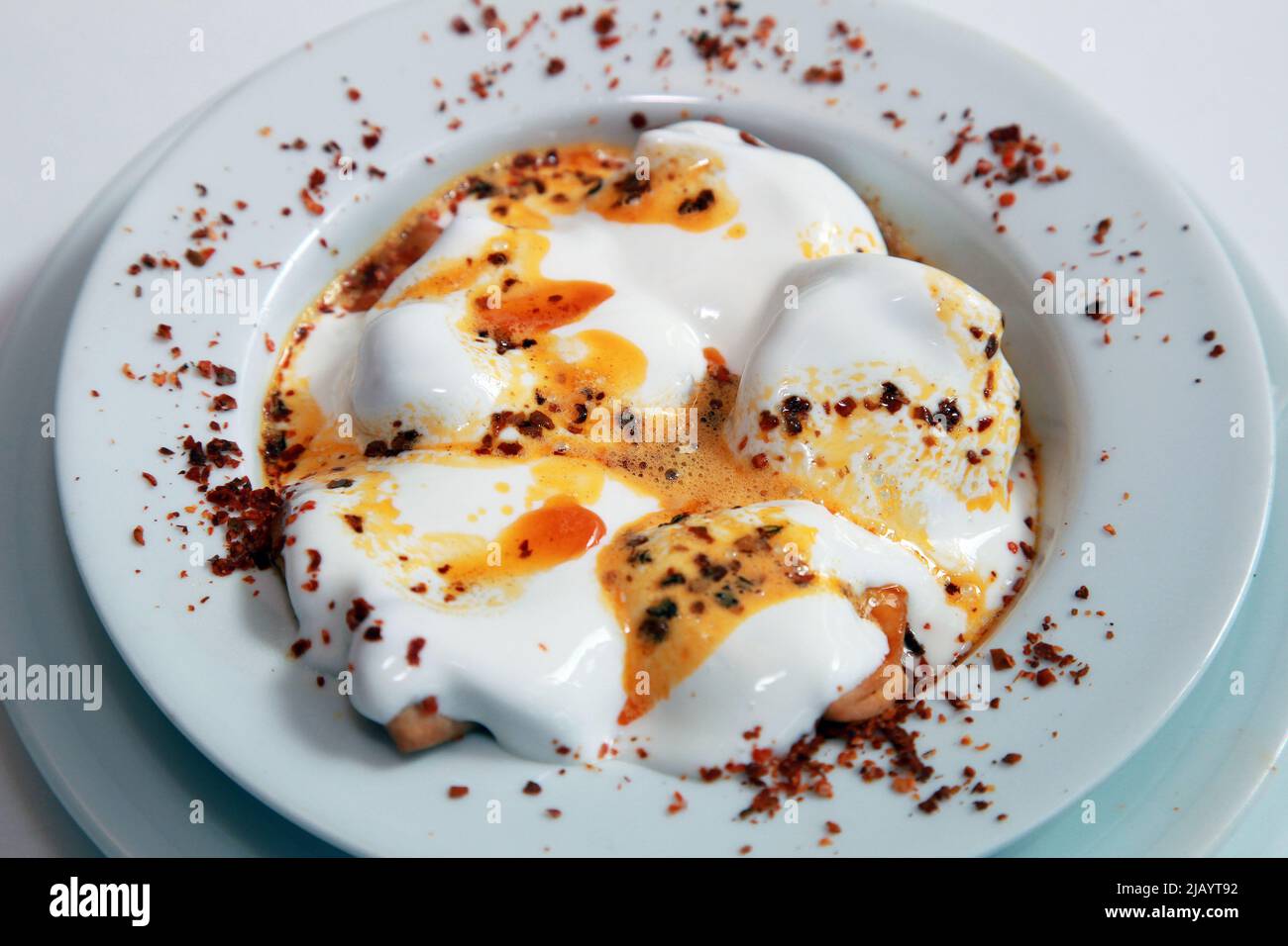 Turkish traditional food 'Manti' (Turkish Ravioli) with yoghurt on the ...