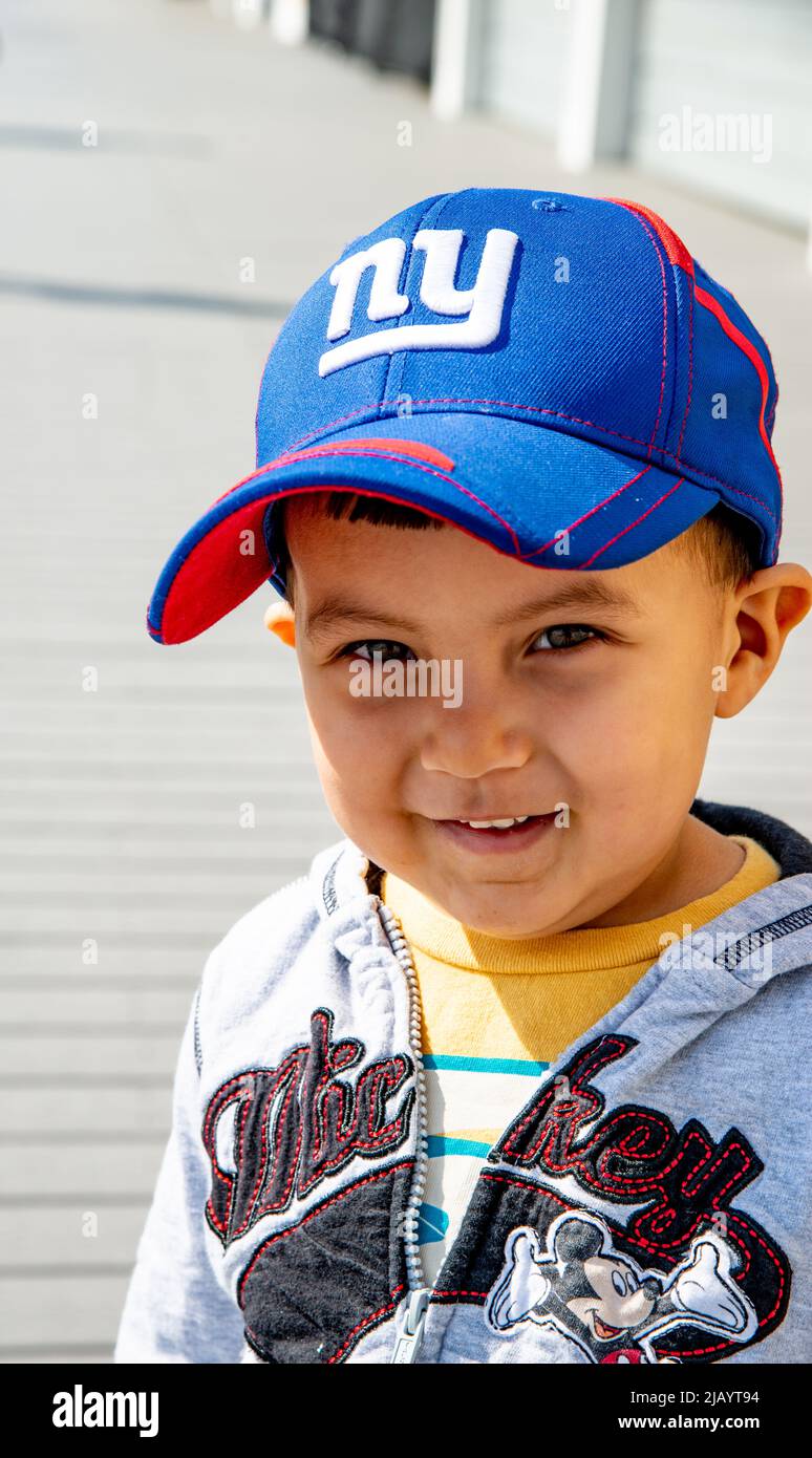Kid in a NY Baseball Cap Stock Photo - Alamy
