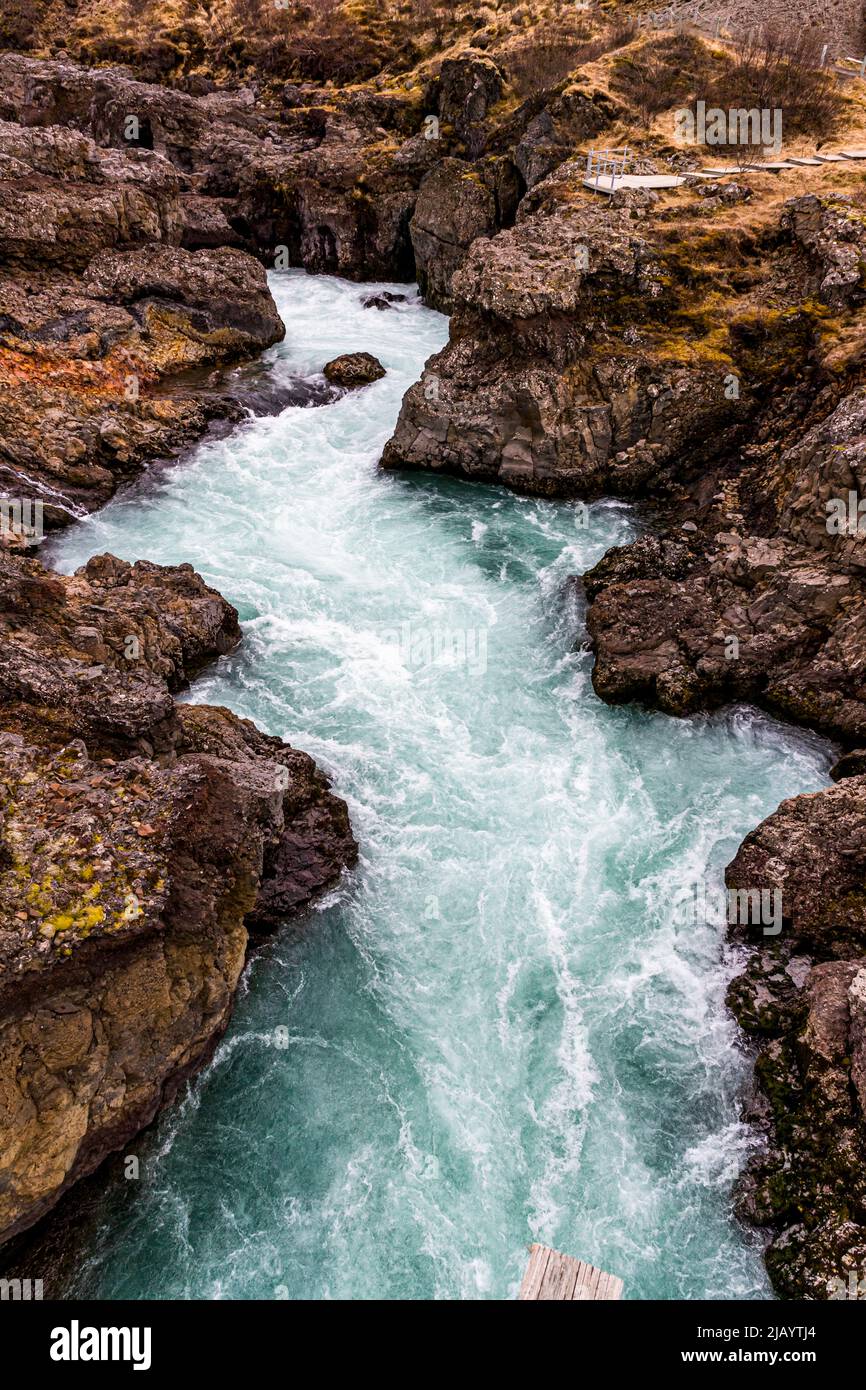 Barnafossar is a storied waterfall near Húsafell, Iceland. It resembles ...