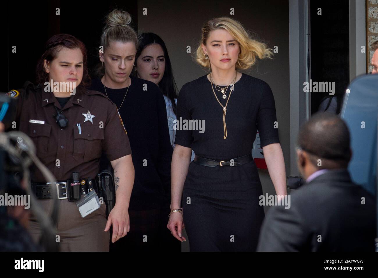Actress Amber Heard, right, and her sister Whitney Heard, left, depart ...