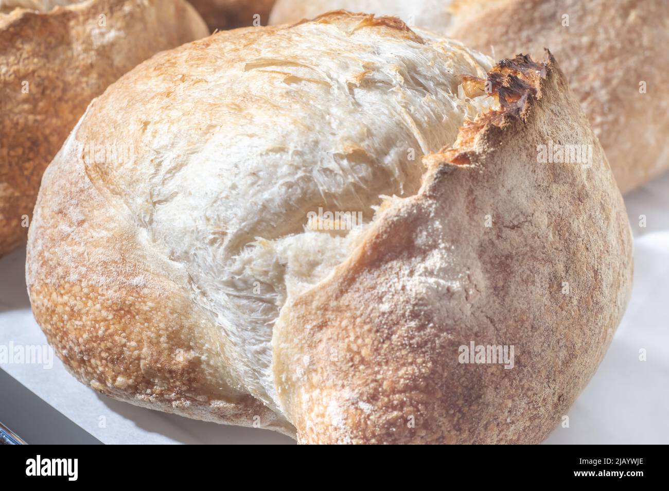 Traditional Italian bread on a shelf with natural light,handmade bread ...