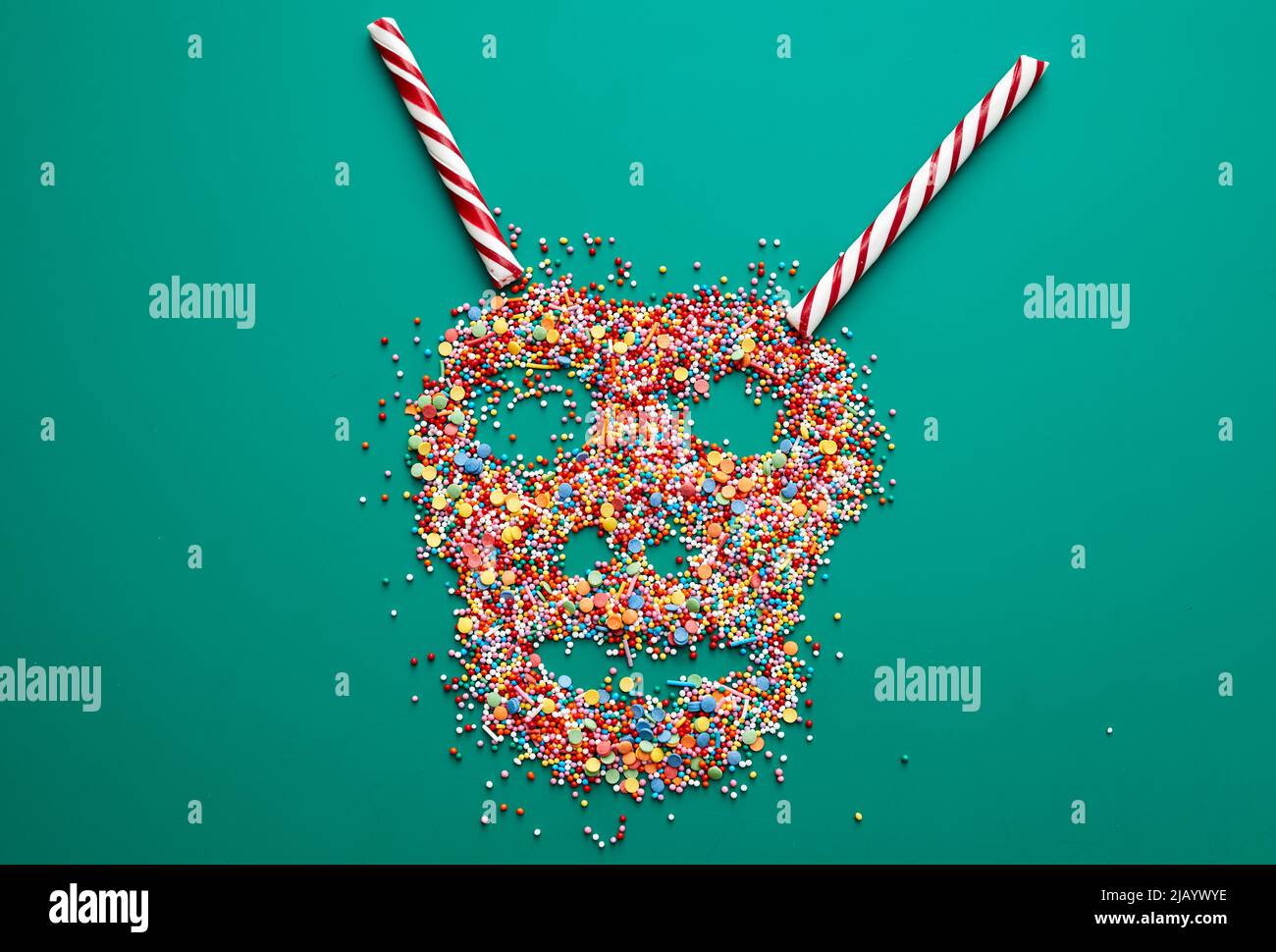 Sweet death concept: colorful sprinkles laid out in shape of human ...