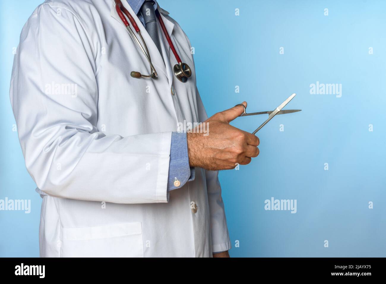 doctor with stethoscope and scissors in his hand Stock Photo - Alamy