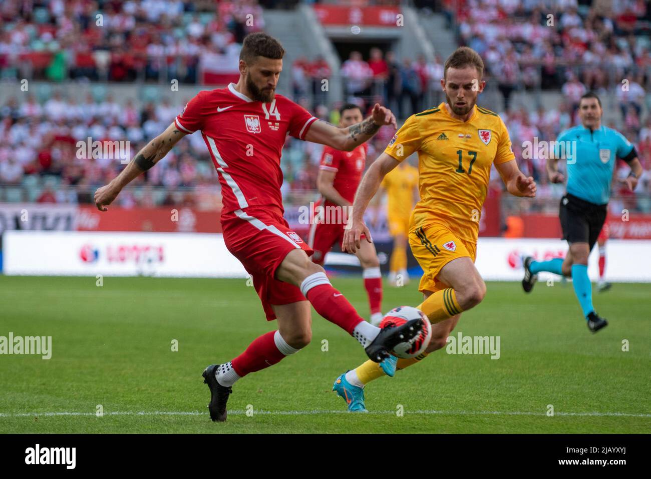 Mateusz Klich of Poland and Rhys Norrington-Davies of Wales during the ...