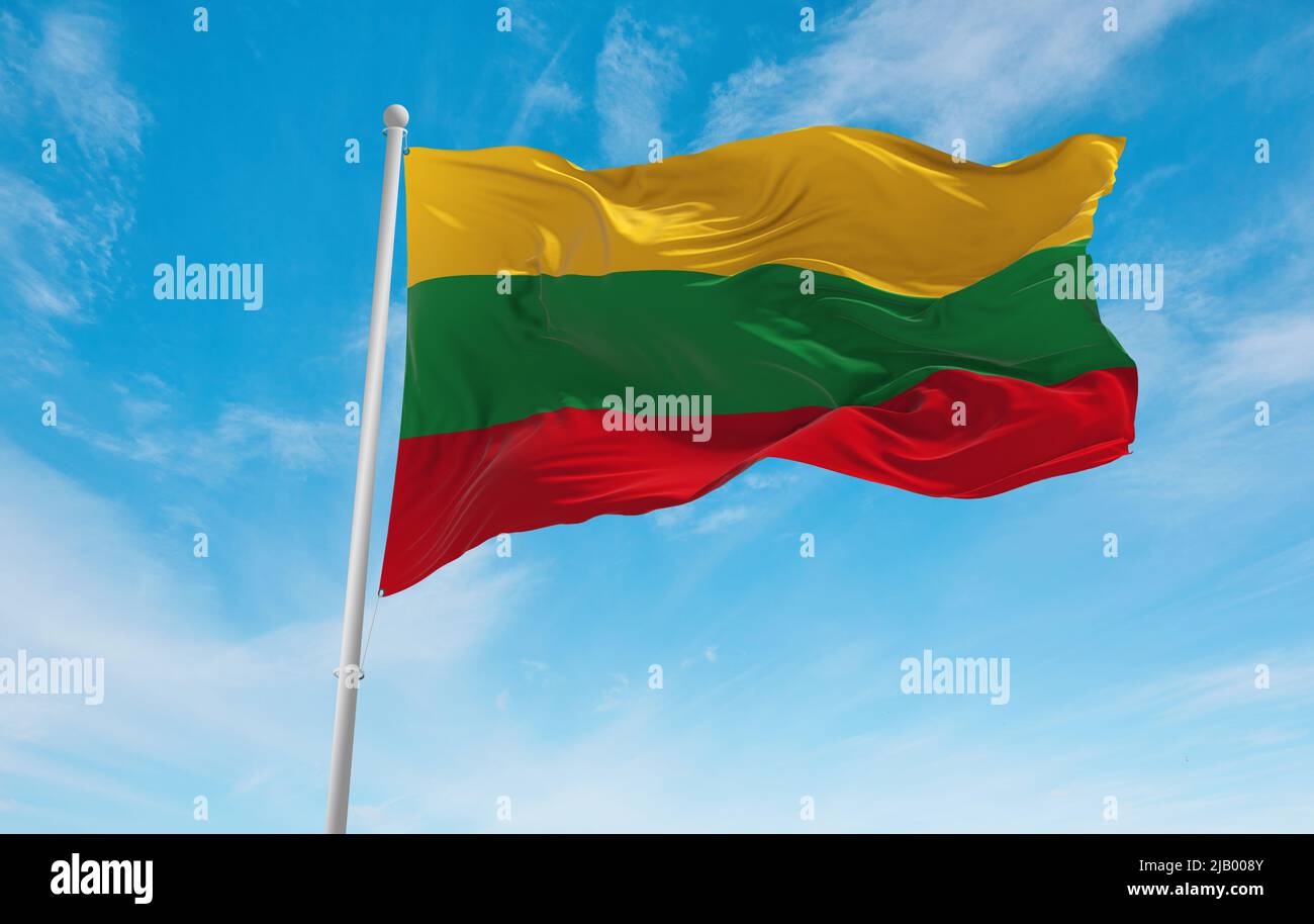 official flag of AEro , Denmark at cloudy sky background on sunset ...