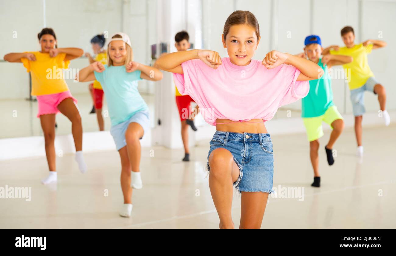 Group of children are learning dance moves in modern studio Stock Photo ...
