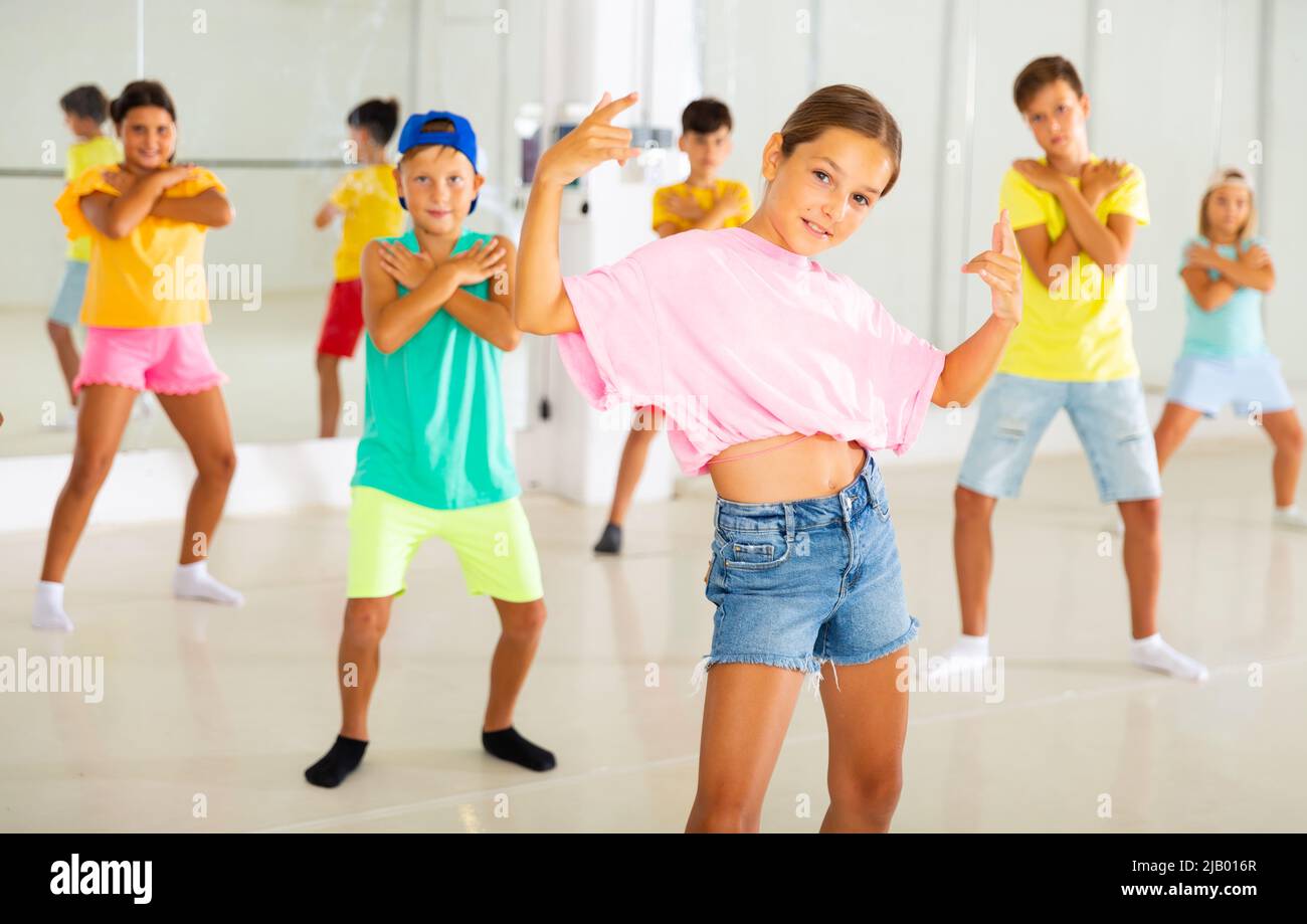 Group of children are learning dance moves in modern studio Stock Photo ...