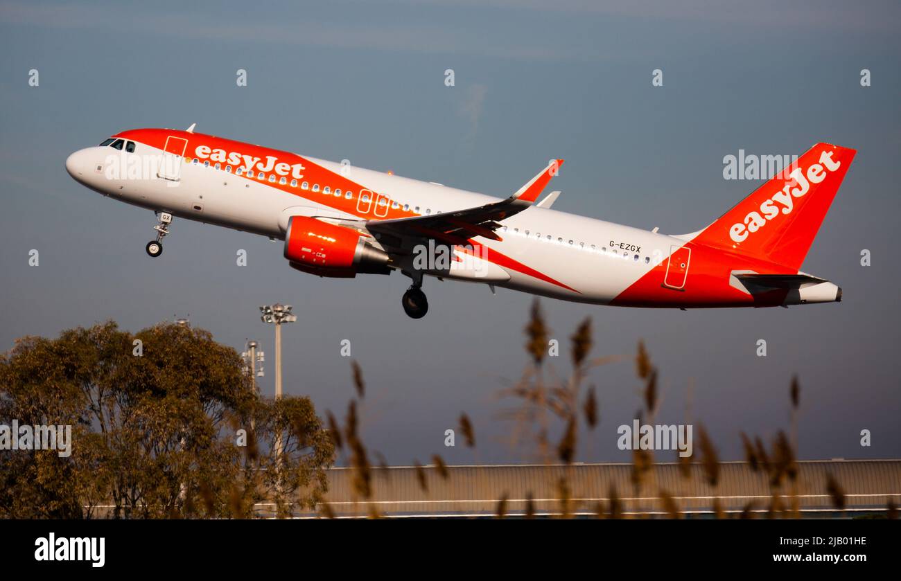 Passenger Airplane of EasyJet airlines taking off from airport Stock ...
