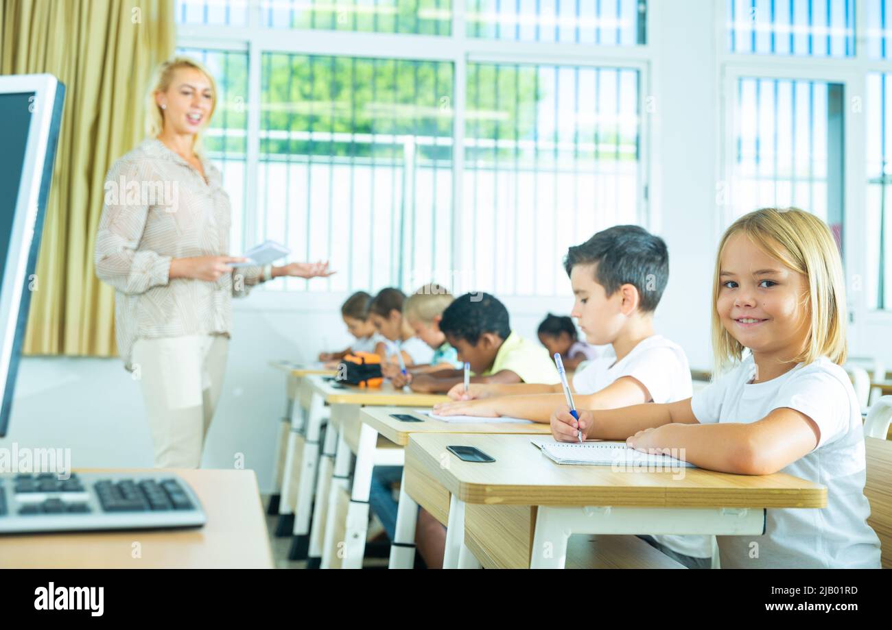 School girl working at lesson in classroom Stock Photo - Alamy