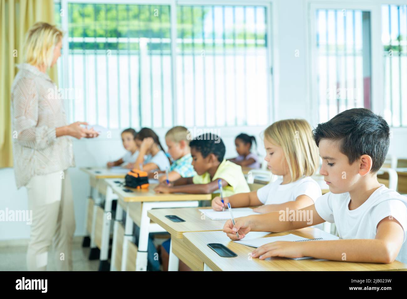 Side view of group of elementary school students Stock Photo - Alamy