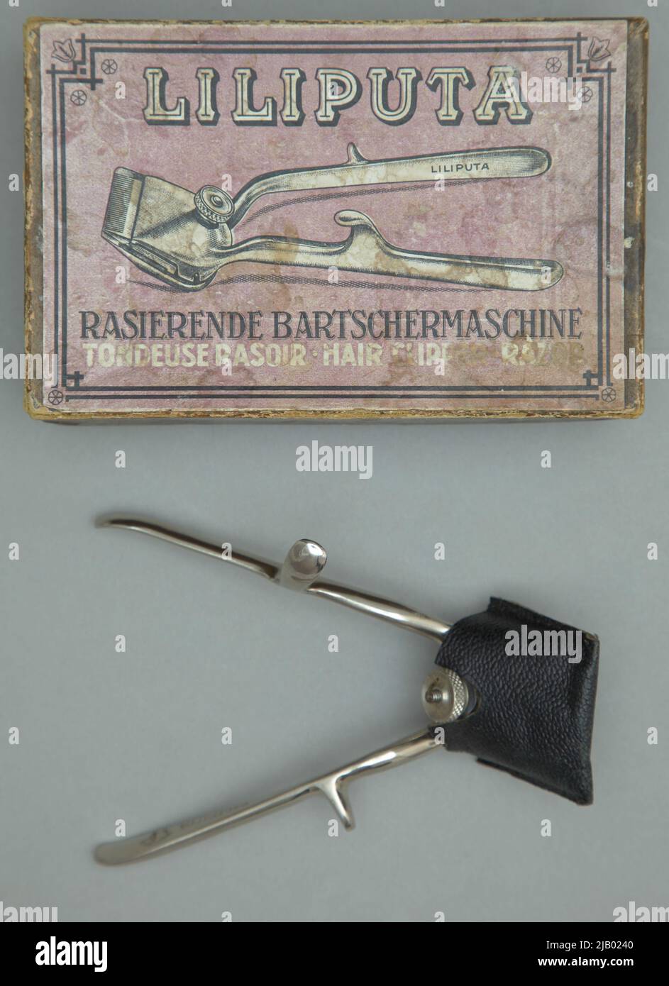 Hair cutting machine from World War I in the case Factory product Stock ...