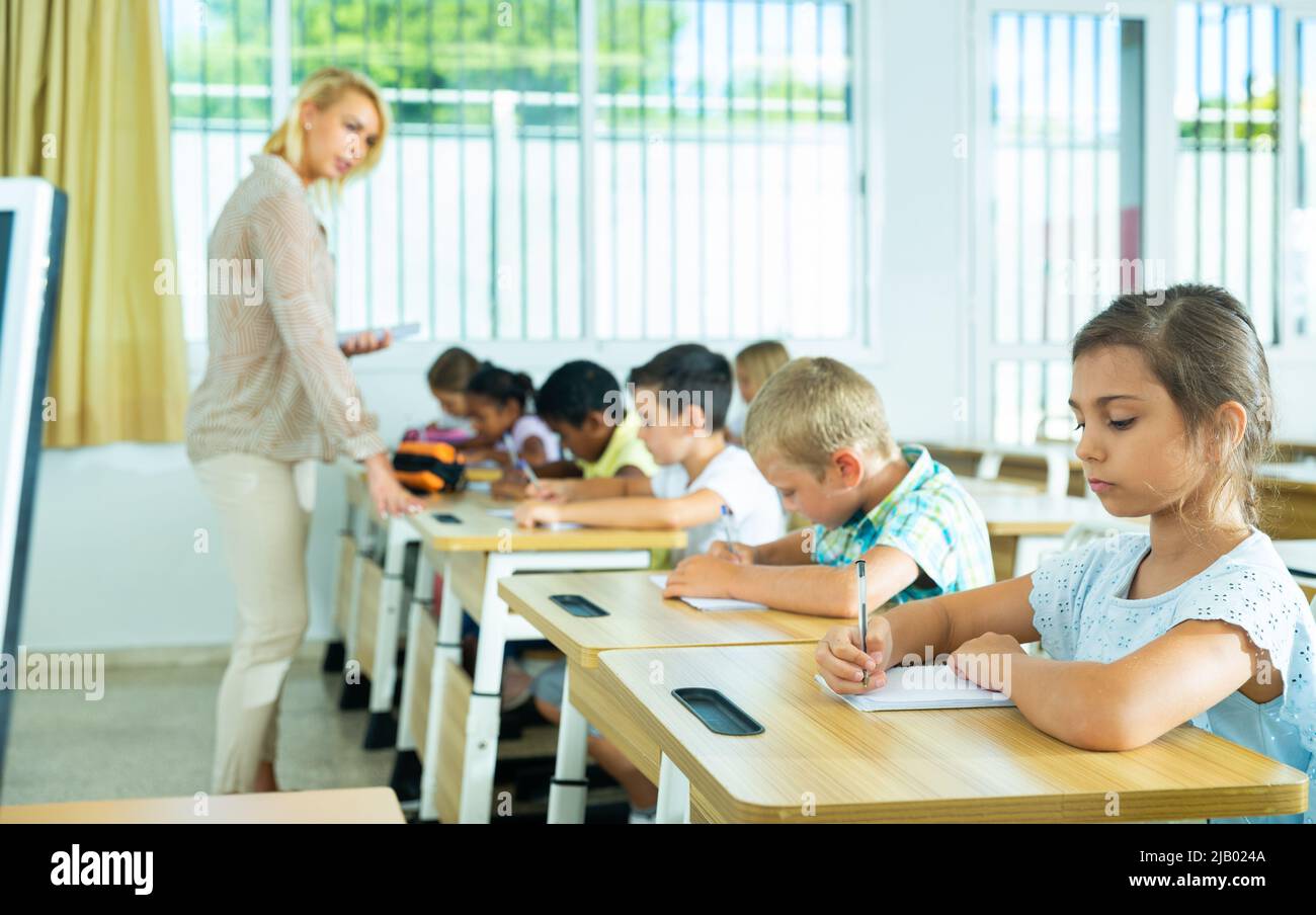Group of focused kids working at class Stock Photo - Alamy