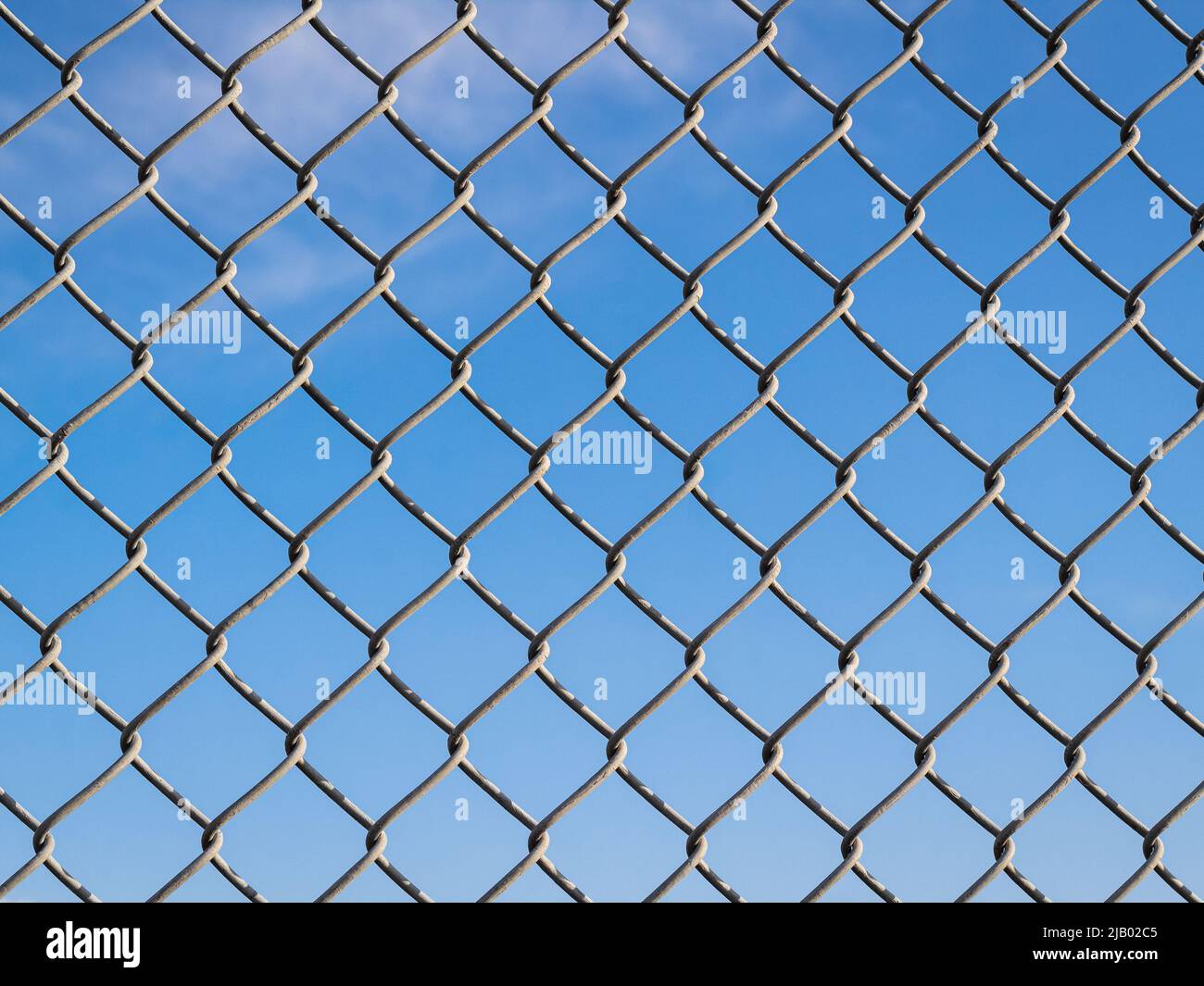 Fence with metal grid in perspective. Metal fence Part of a metal grid ...