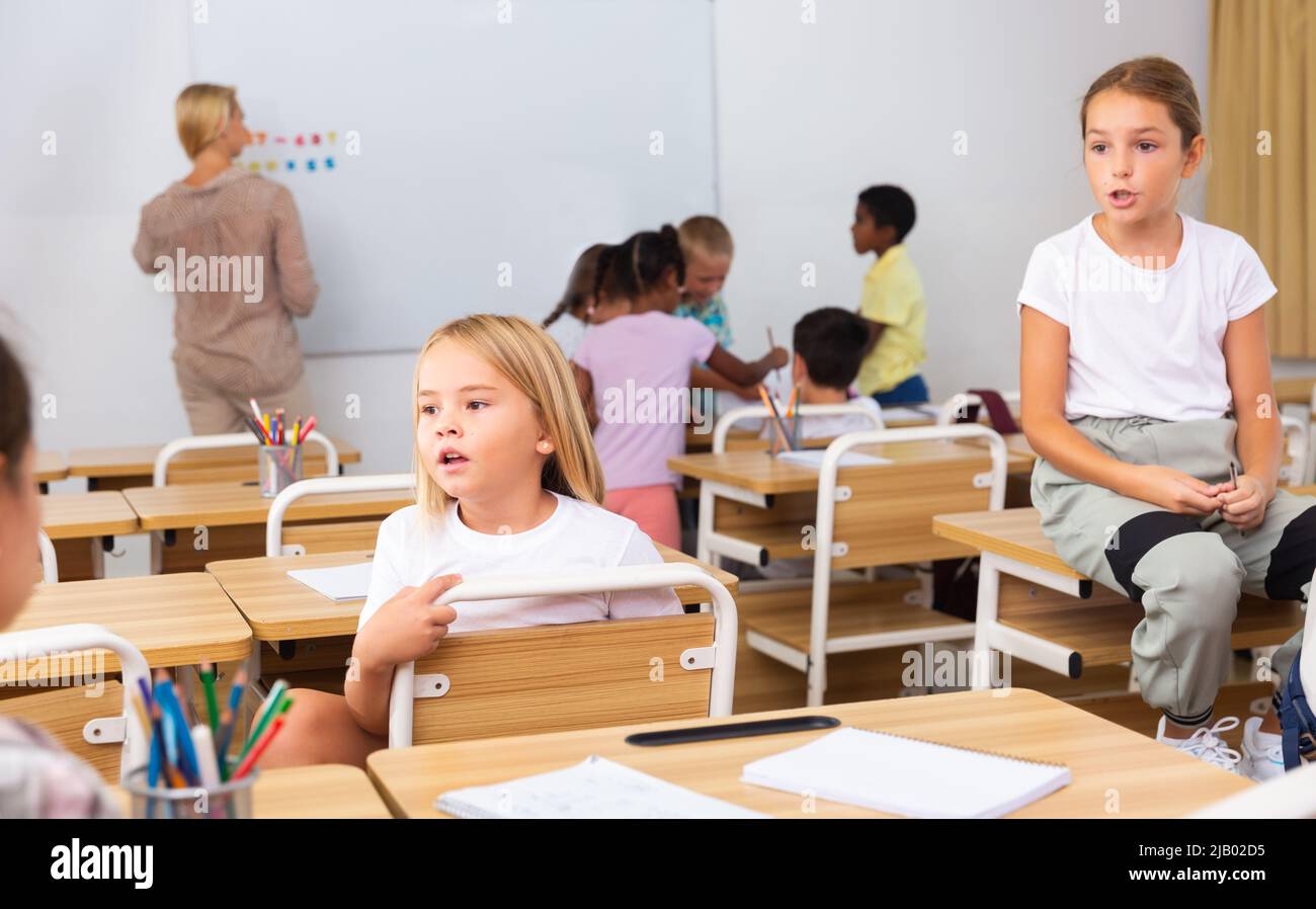 Kids pupils talking during recess between lessons Stock Photo - Alamy